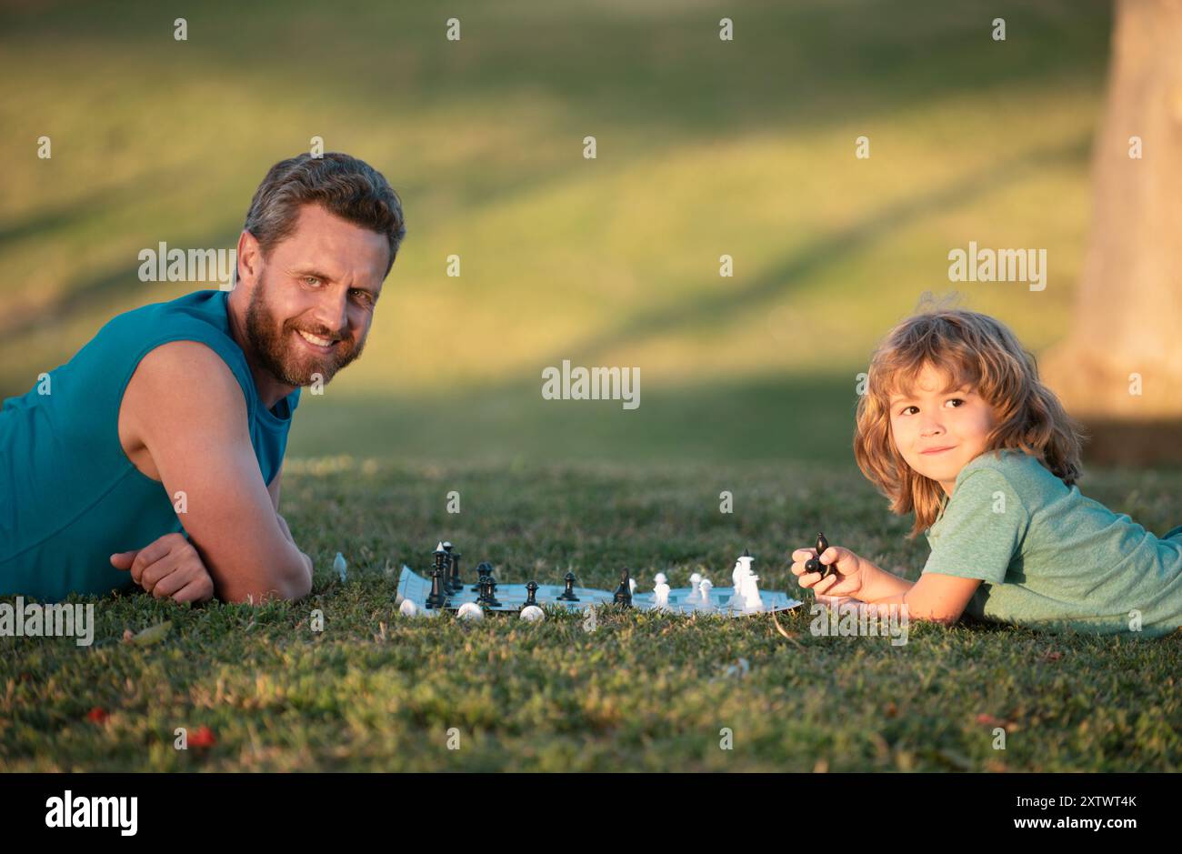 Father and son playing chess spending time together outdoor. Clever ...