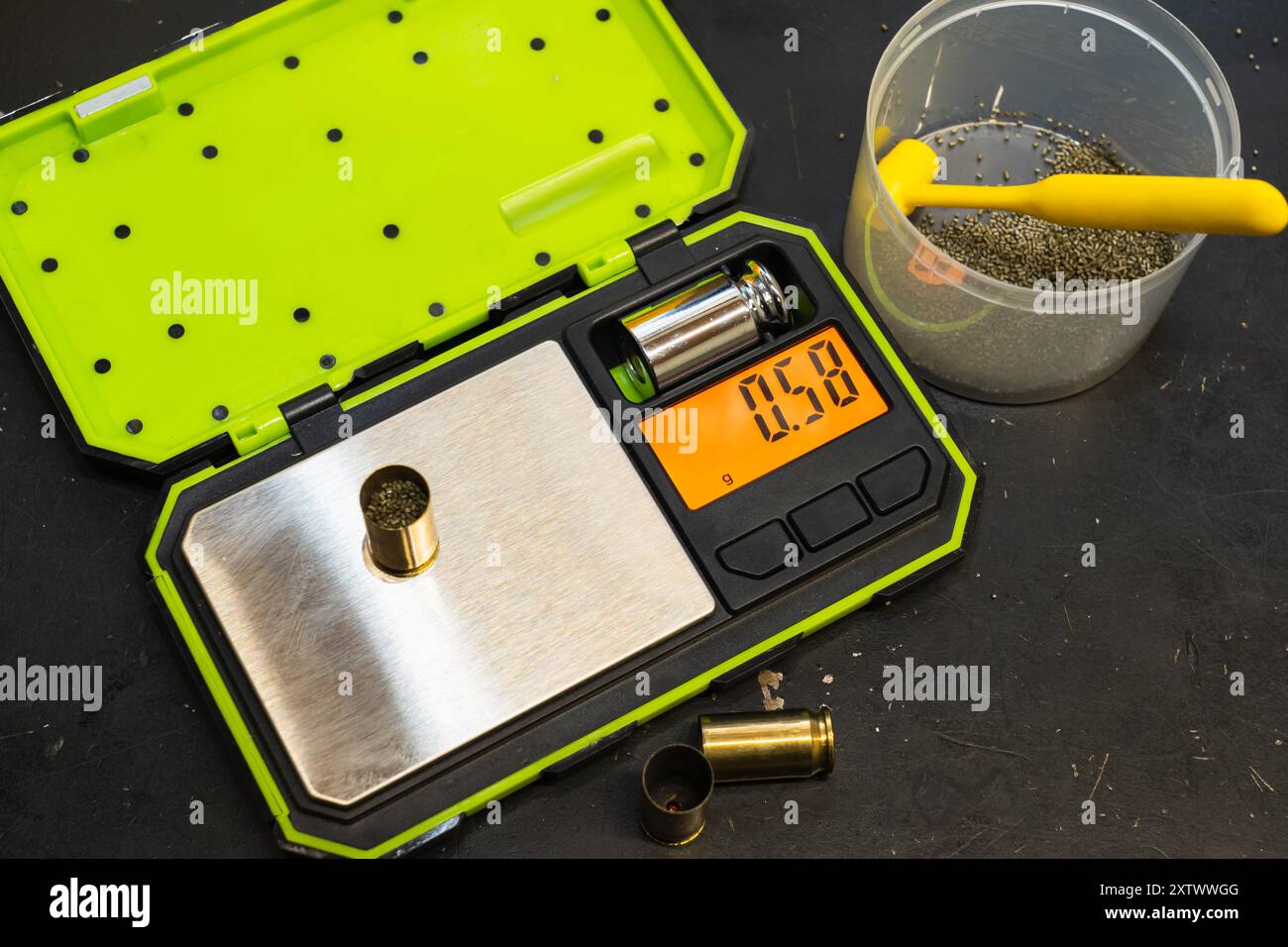 Reloading 45 acp pistol caliber cartridges, scales for weighing ...