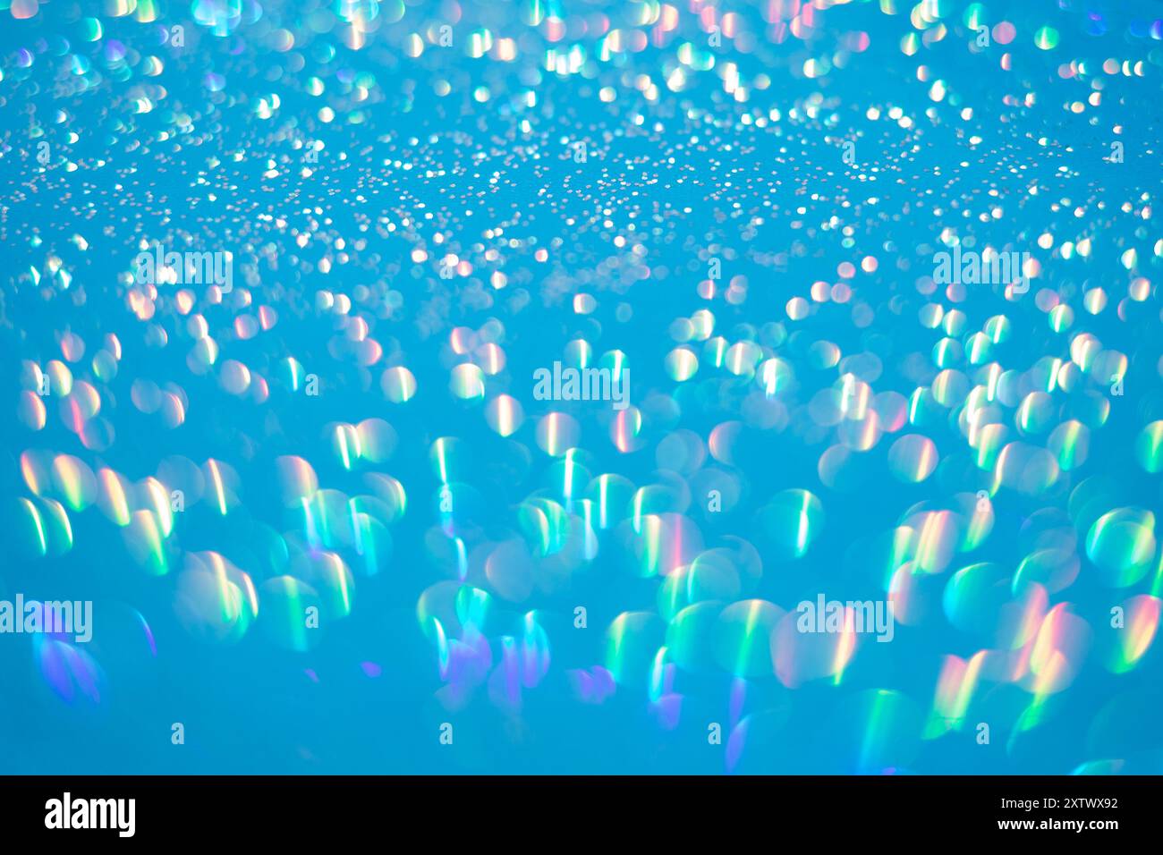 A multitude of small, defocused light points creating a bokeh effect on ...