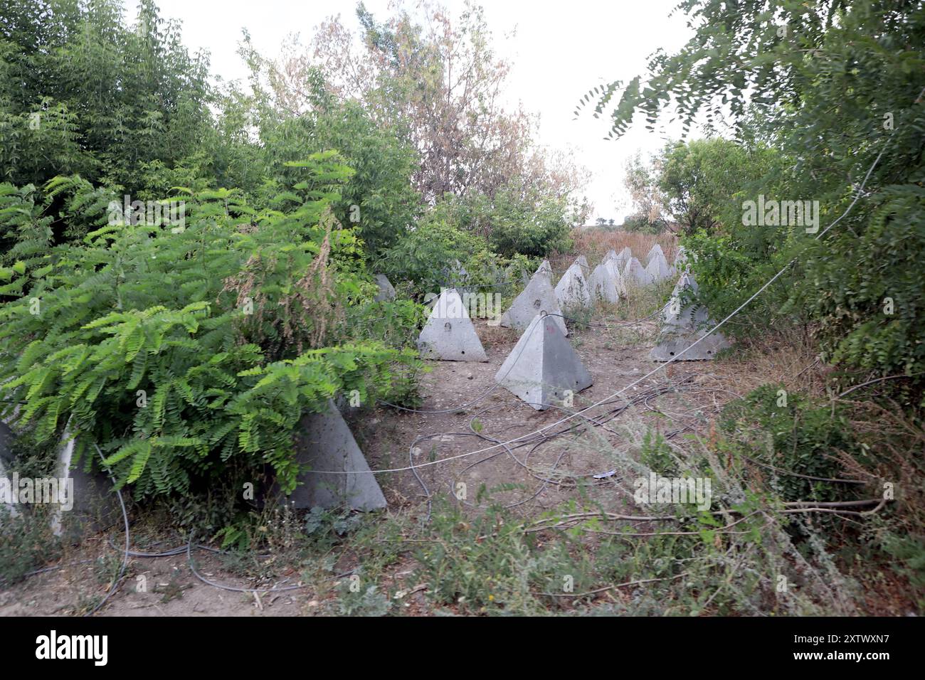 DONETSK REGION, UKRAINE - AUGUST 15, 2024 - Dragon’s teeth are at the ...