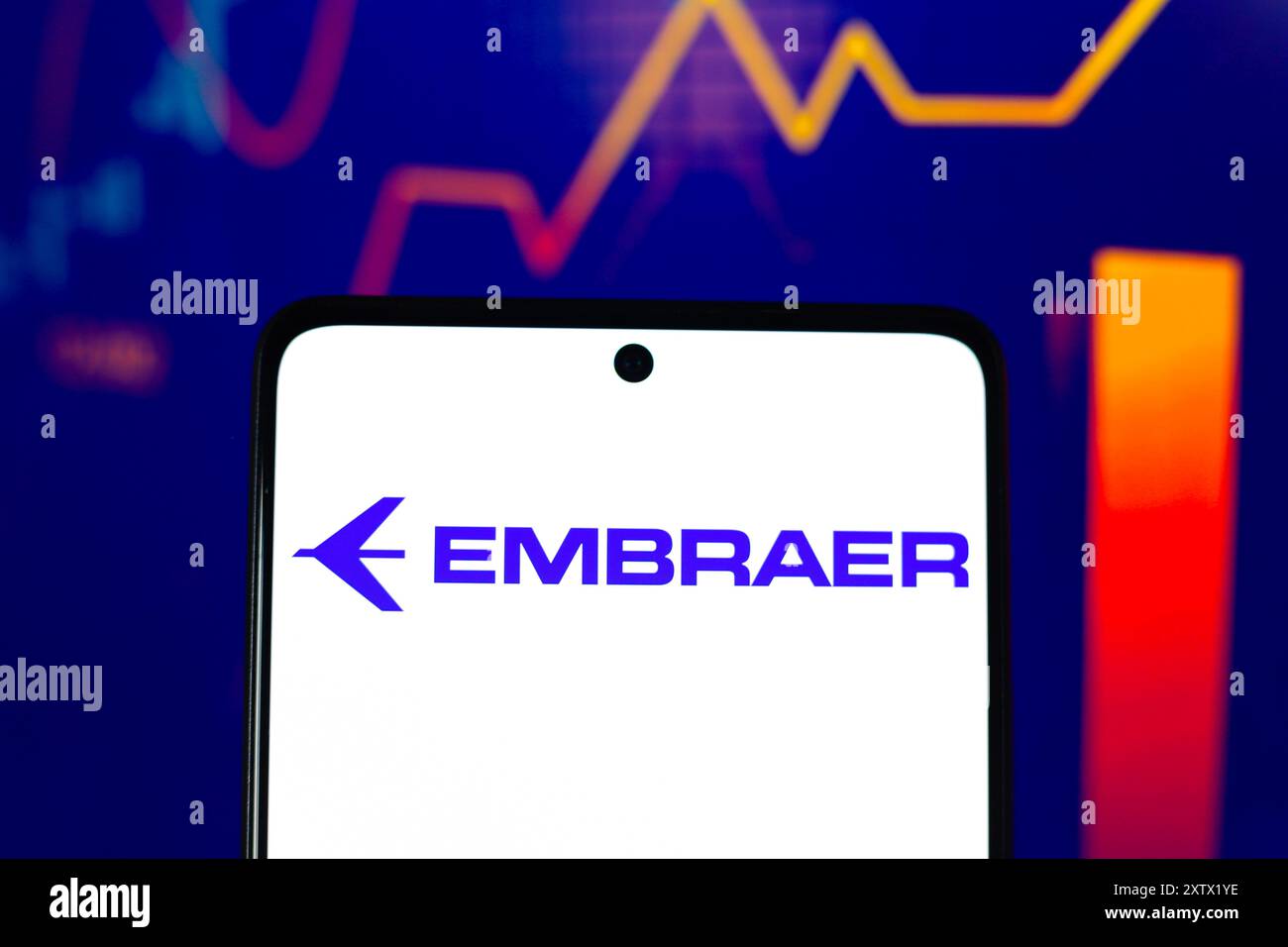 In this photo illustration, the Embraer S.A. logo is displayed on a ...