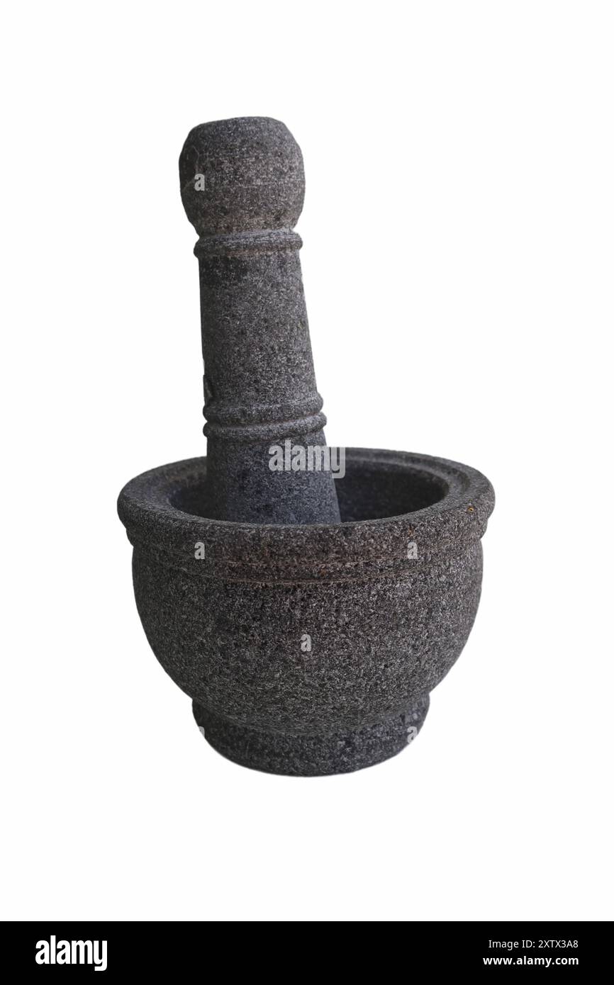 A large mortar and pestle sits on a white background. The mortar is ...