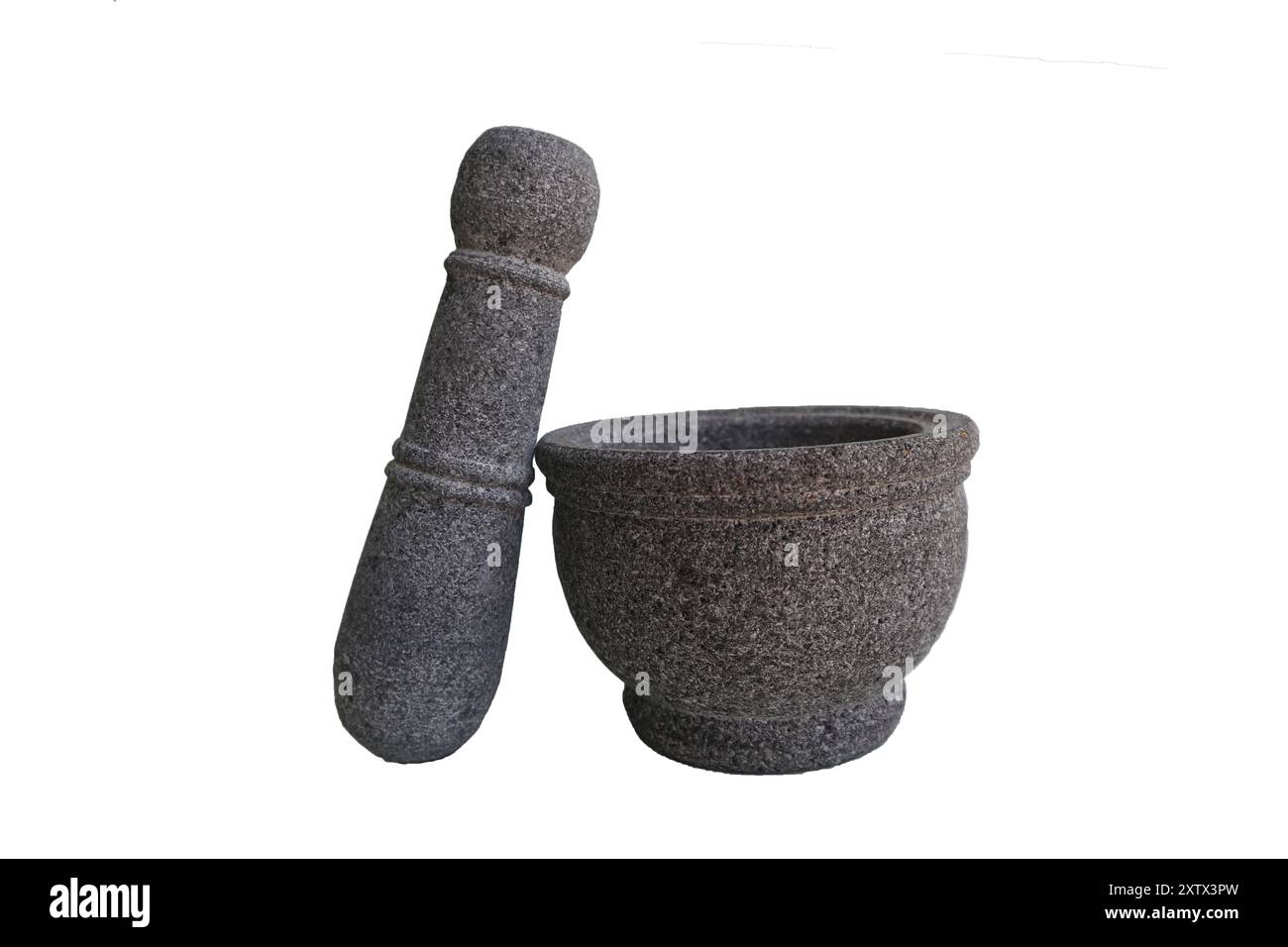 A large mortar and pestle sits on a white background. The mortar is ...