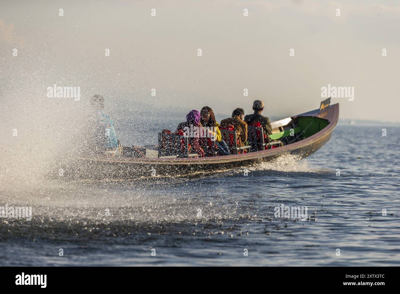 Water spitting canoe whizzing on water Stock Photo - Alamy