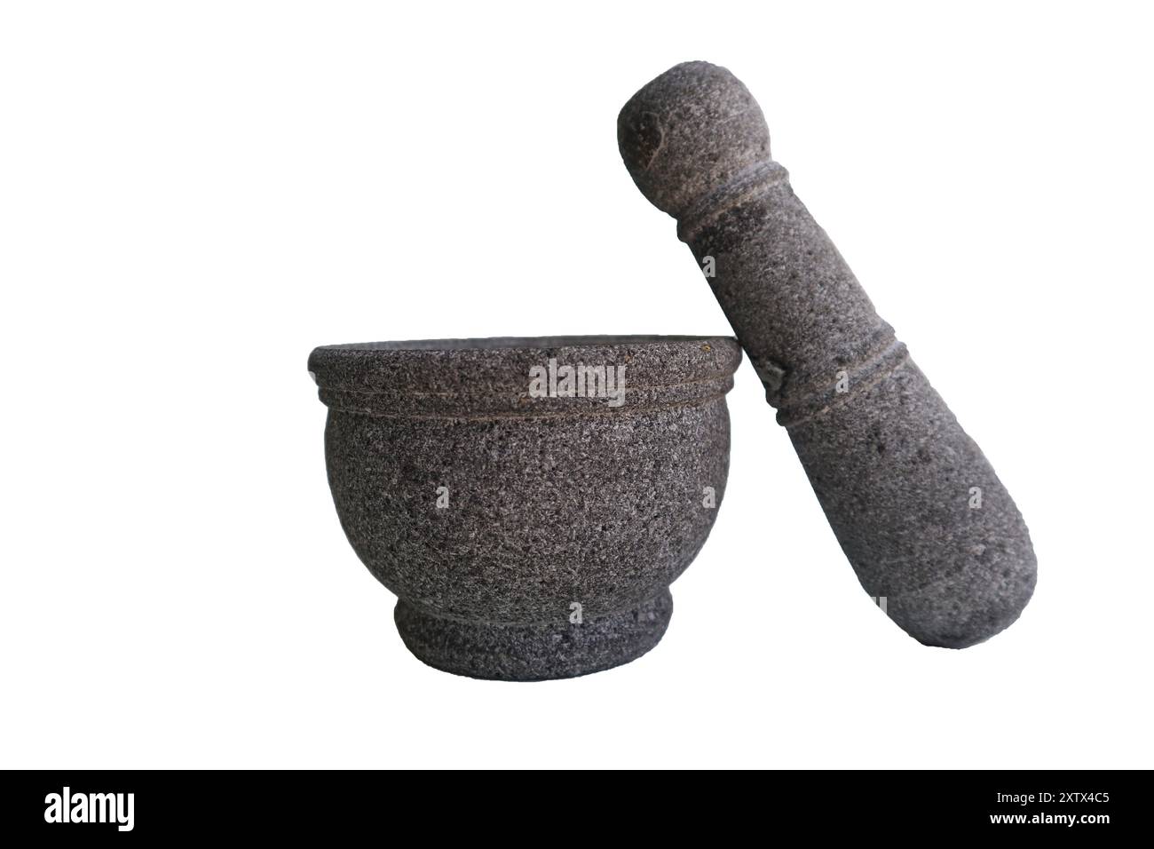 A large mortar and pestle sits on a white background. The mortar is ...