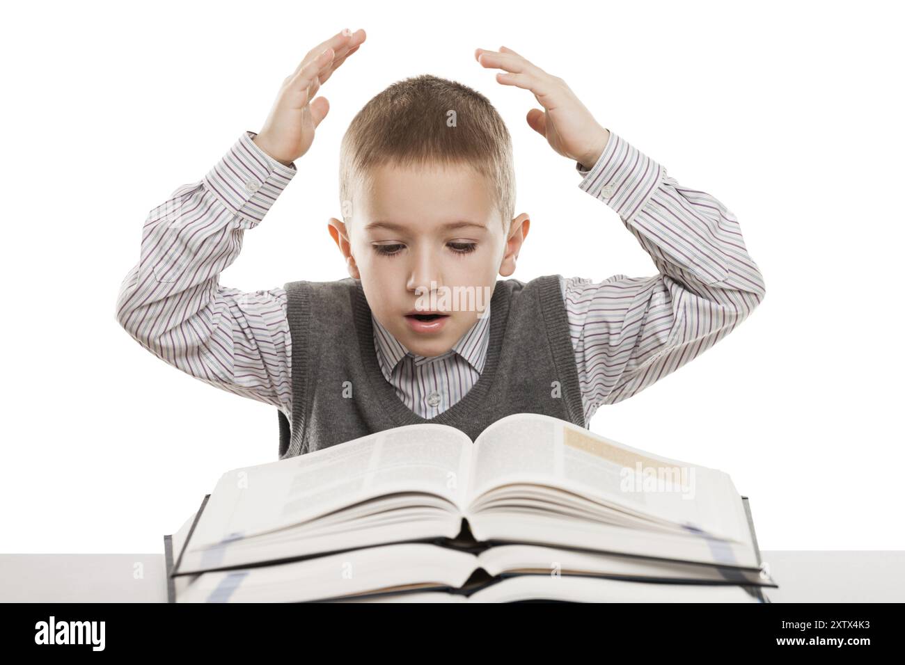 Surprised boy reading book hi-res stock photography and images - Alamy