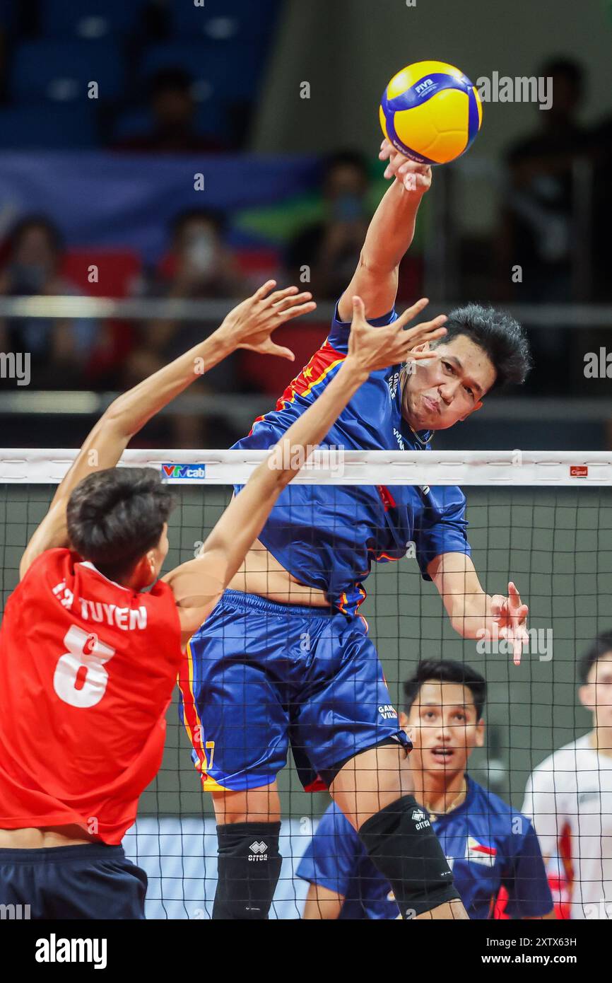 Manila, Philippines. 16th Aug, 2024. Kim Malabunga (C) of the Philippines spikes the ball during ...