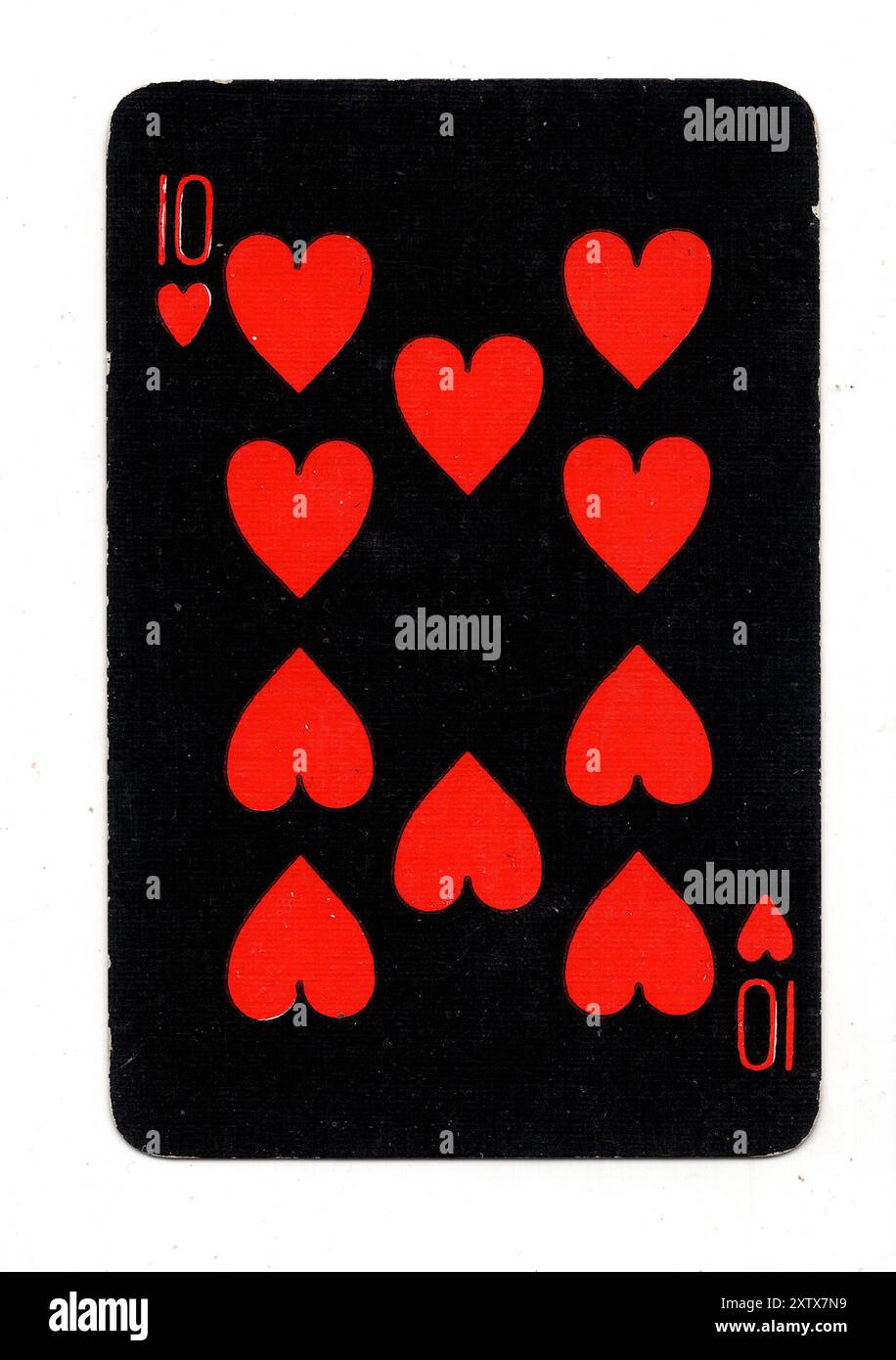 A vintage black ten of hearts playing card isolated on a white ...