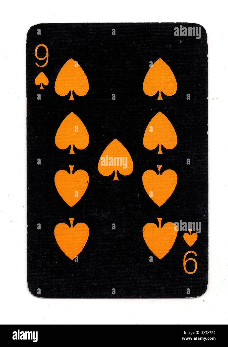 A vintage black nine of spades playing card isolated on a white ...