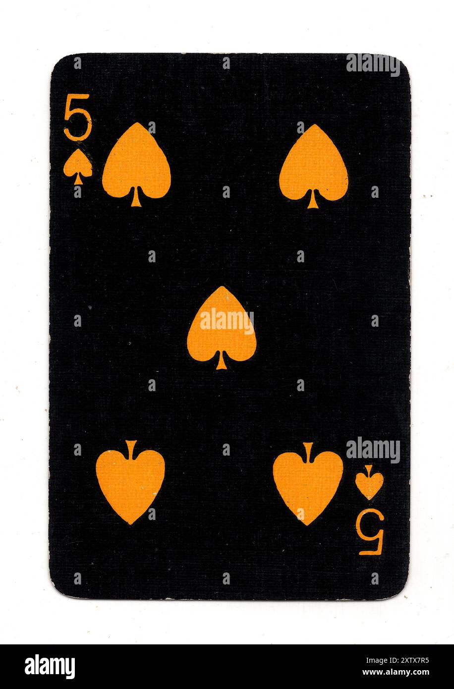 A vintage black five of spades playing card isolated on a white ...