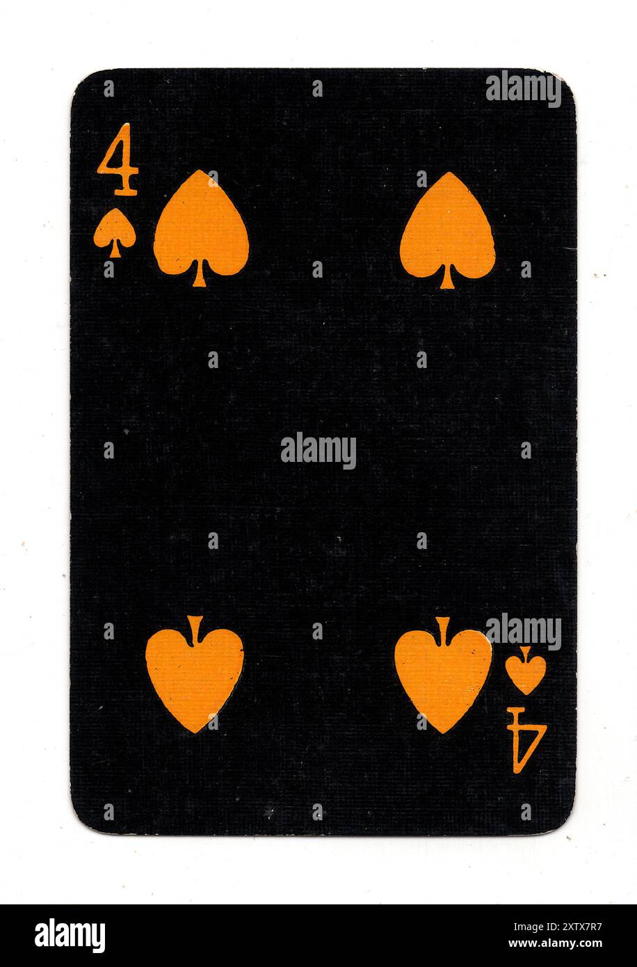 A vintage black four of spades playing card isolated on a white ...