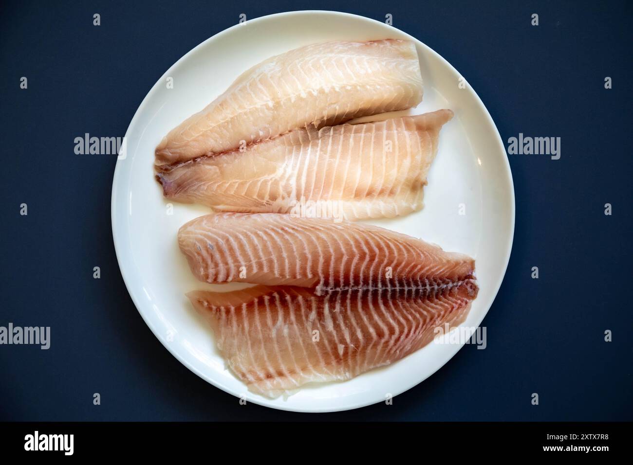 Fillet of tilapia or Saint Peter fish Oreochromis niloticus. Isolated ...