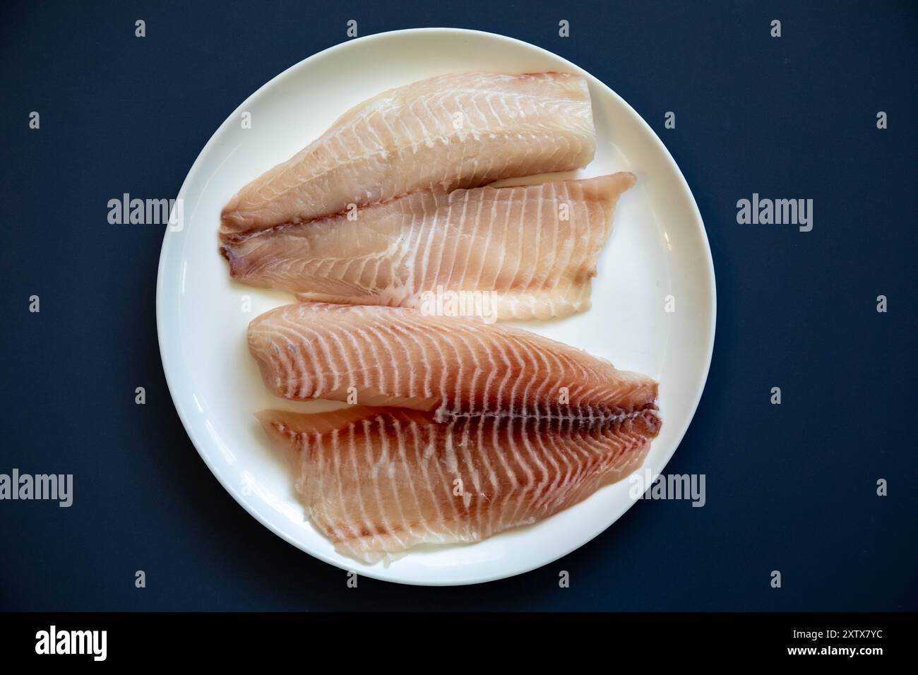 Fillet of tilapia or Saint Peter fish Oreochromis niloticus. Isolated ...