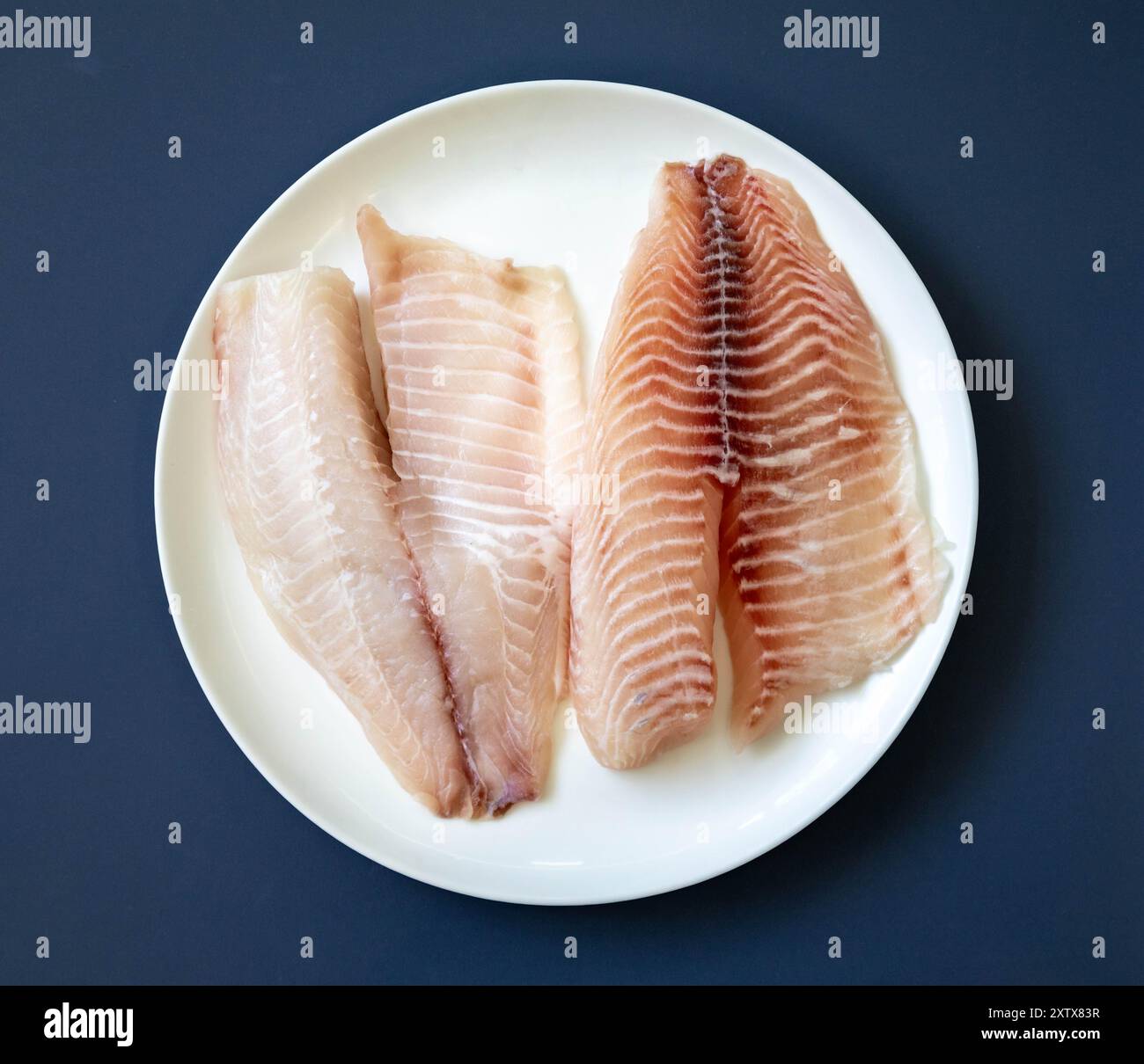 Fillet of tilapia or Saint Peter fish Oreochromis niloticus. Isolated ...