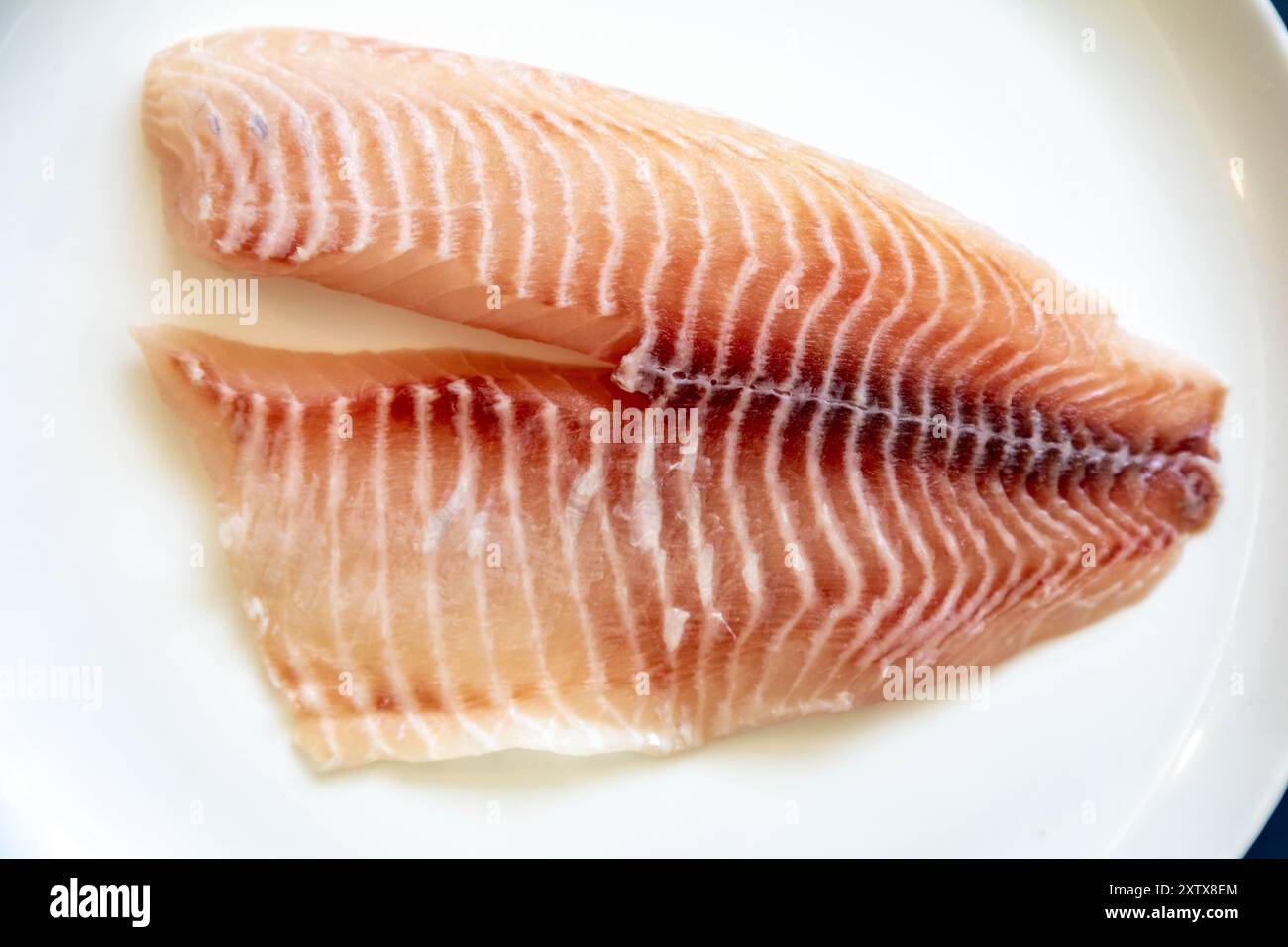 Fillet of tilapia or Saint Peter fish Oreochromis niloticus. Isolated ...