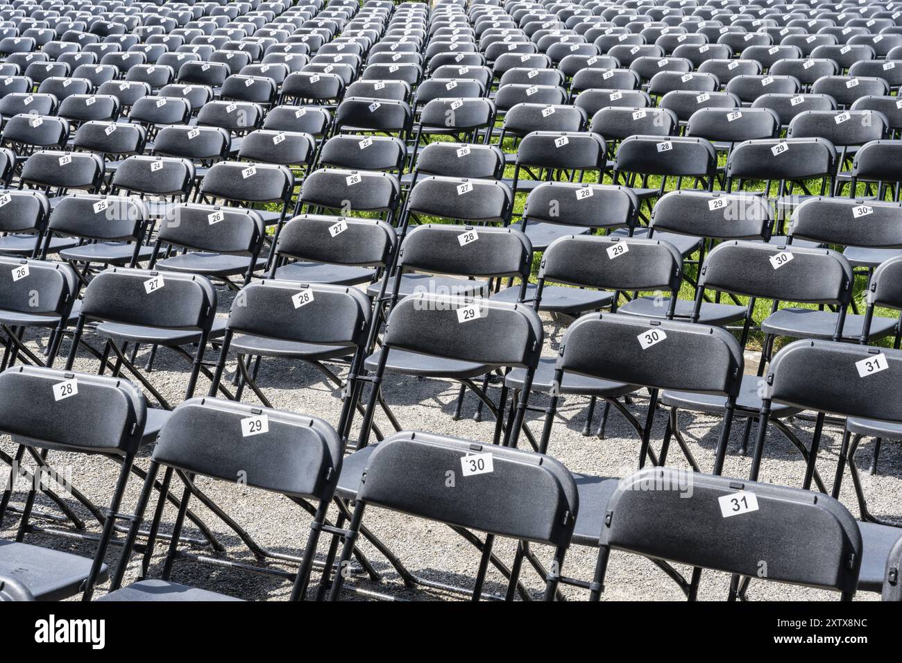 Chairs marked with numbers, rows of seats, rows of chairs at a music ...