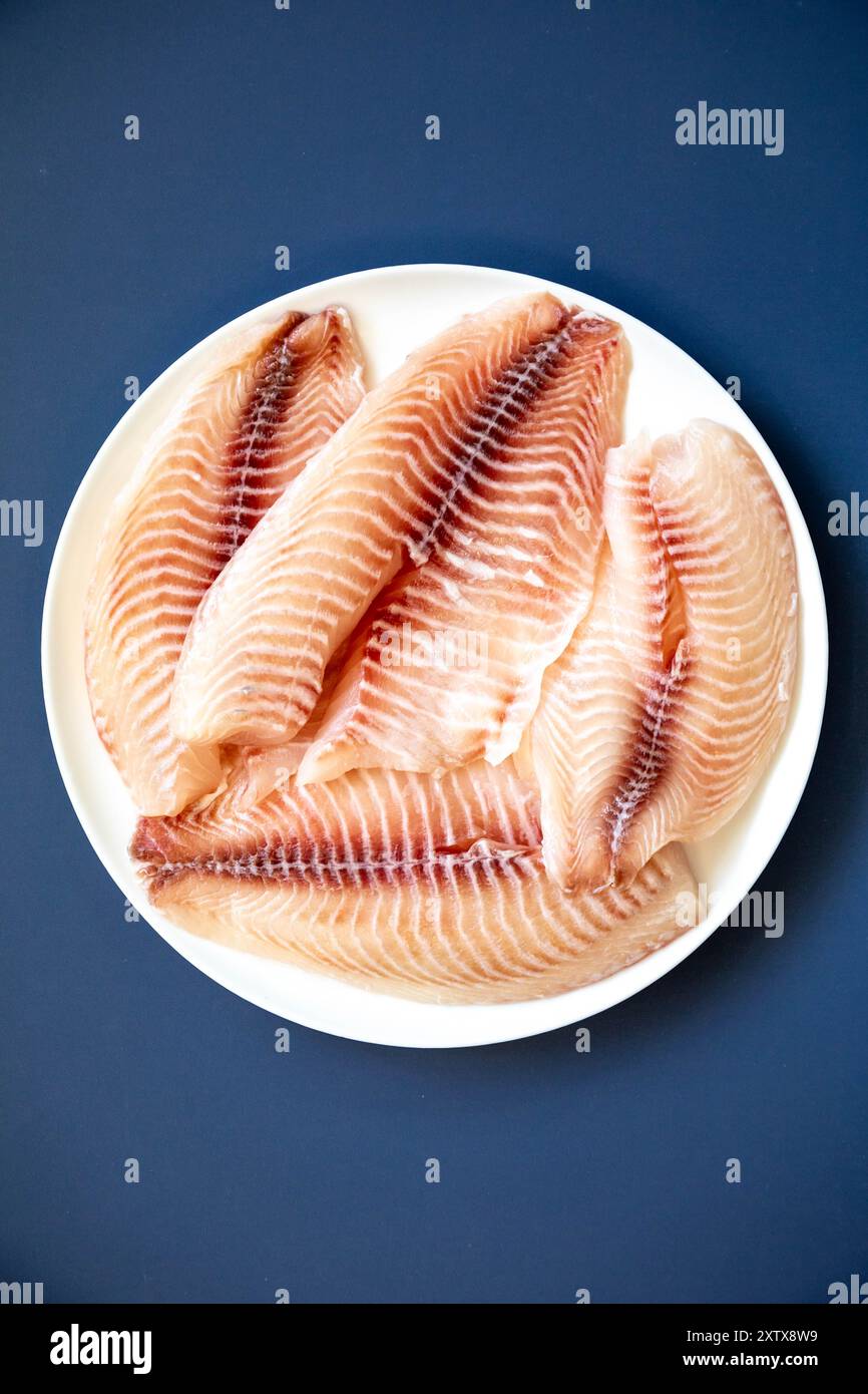Fillet of tilapia or Saint Peter fish Oreochromis niloticus. Isolated ...