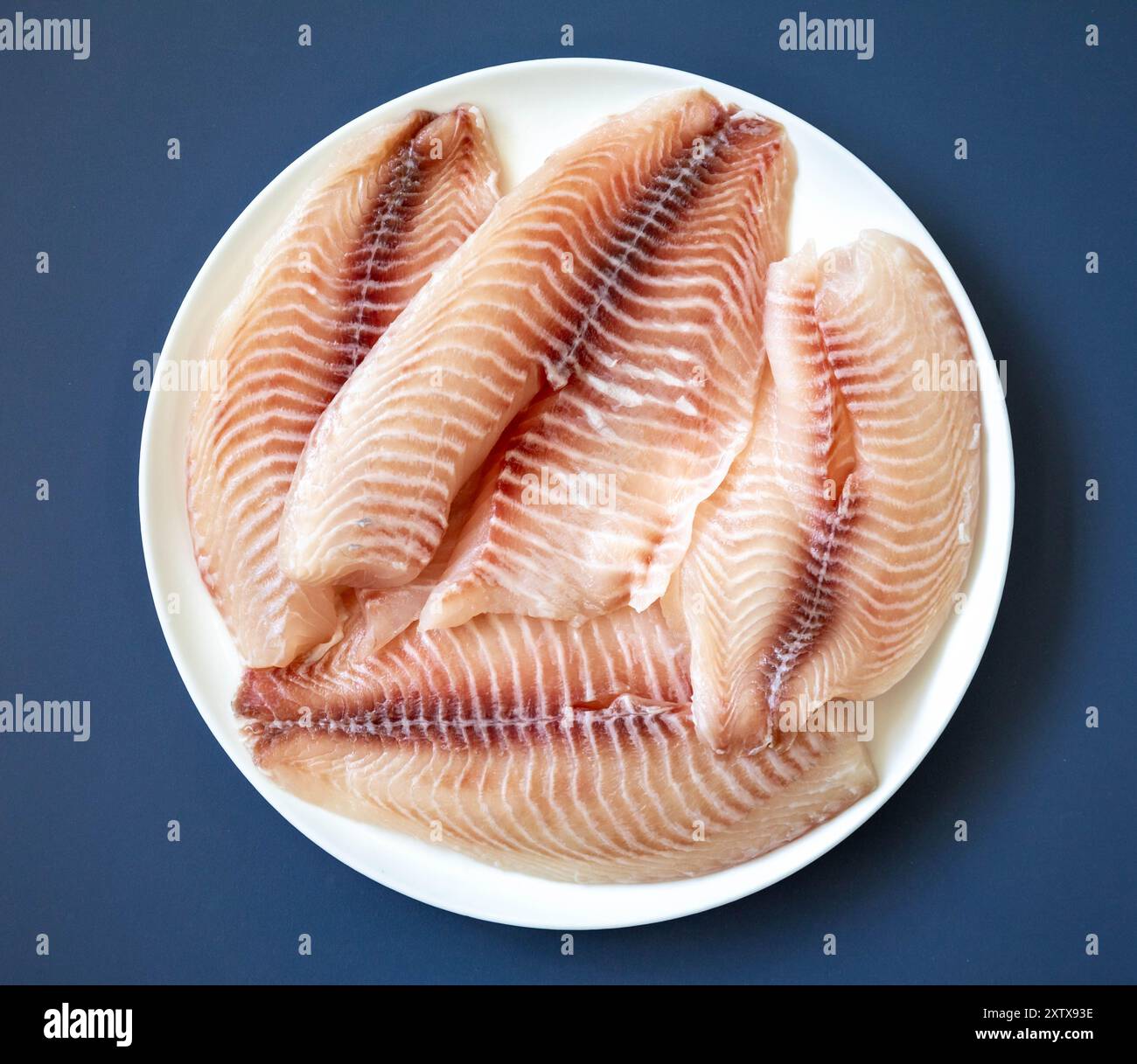 Fillet of tilapia or Saint Peter fish Oreochromis niloticus. Isolated ...