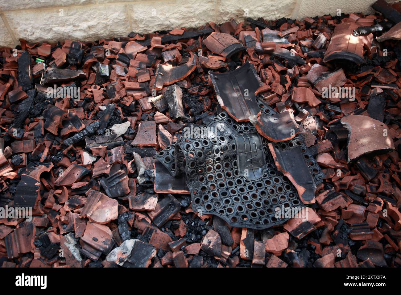 People check a burnt car a day after an attack by Jewish settlers on the village of Jit near ...
