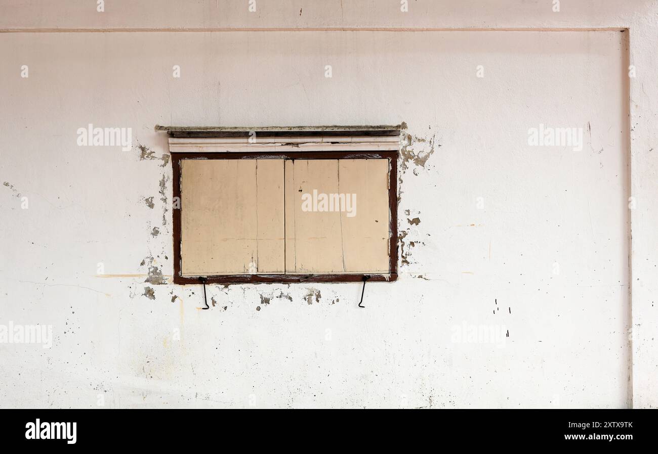 dusty white ancient building facade with the Beige wooden windows Stock ...