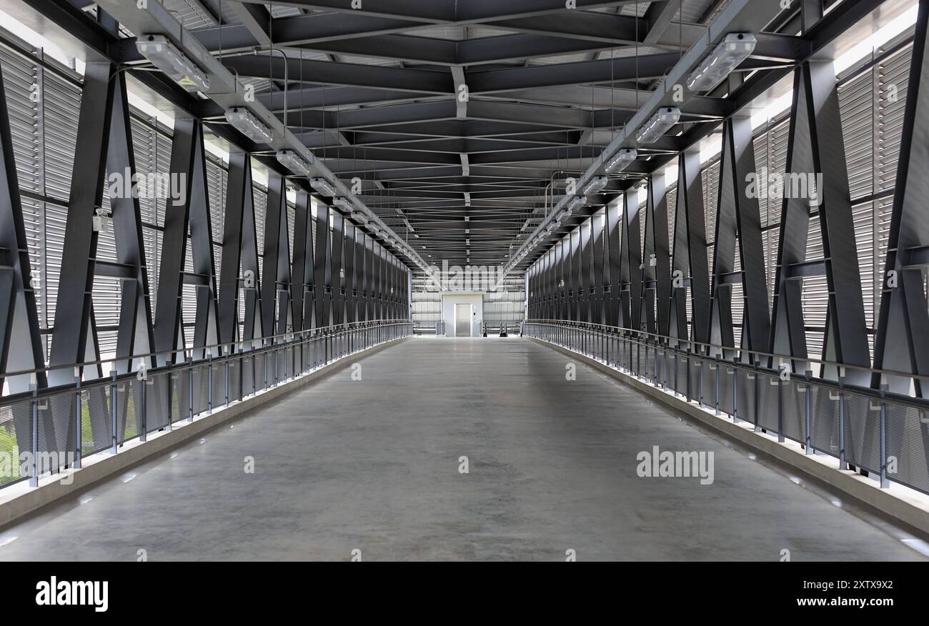 Pedestrian pathway or corridor or hallway between train station and ...