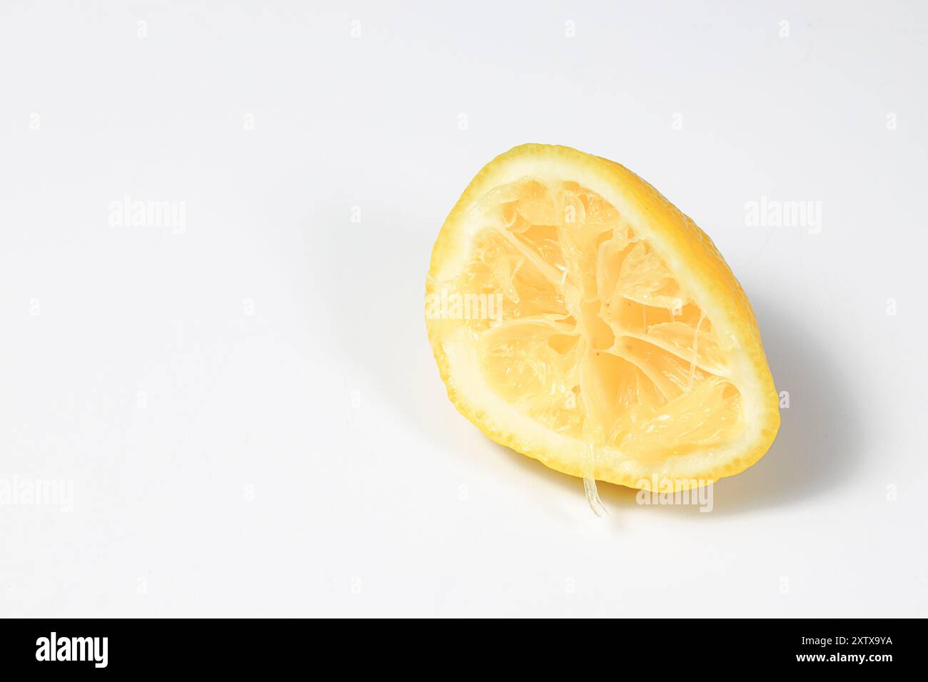 Fresh squeezed lemon fruit isolated on white background Stock Photo - Alamy