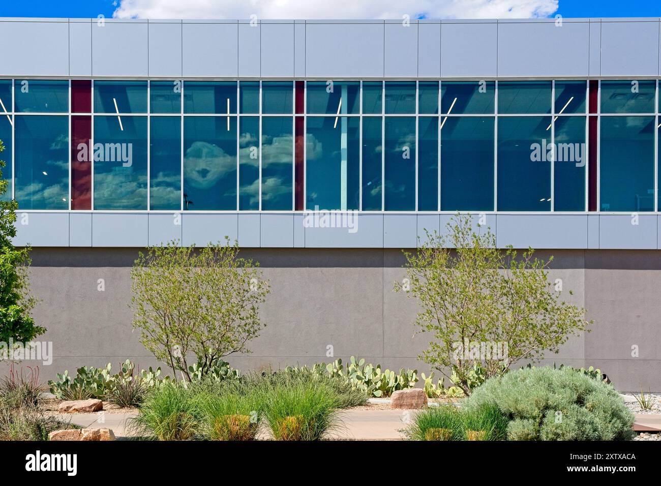 Cloud reflections in windows of contemporary style Johnson Center on ...