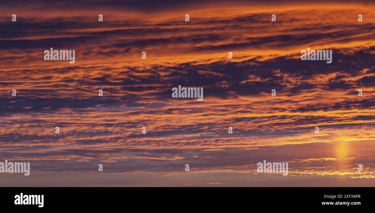 Beautiful nature, dramatic orange sunset on cloud sky Stock Photo - Alamy