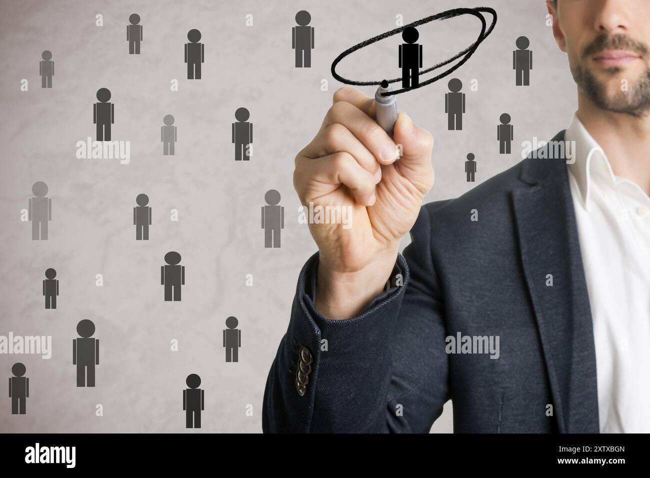 Man drawing a circle around a person from a group. Human resources ...
