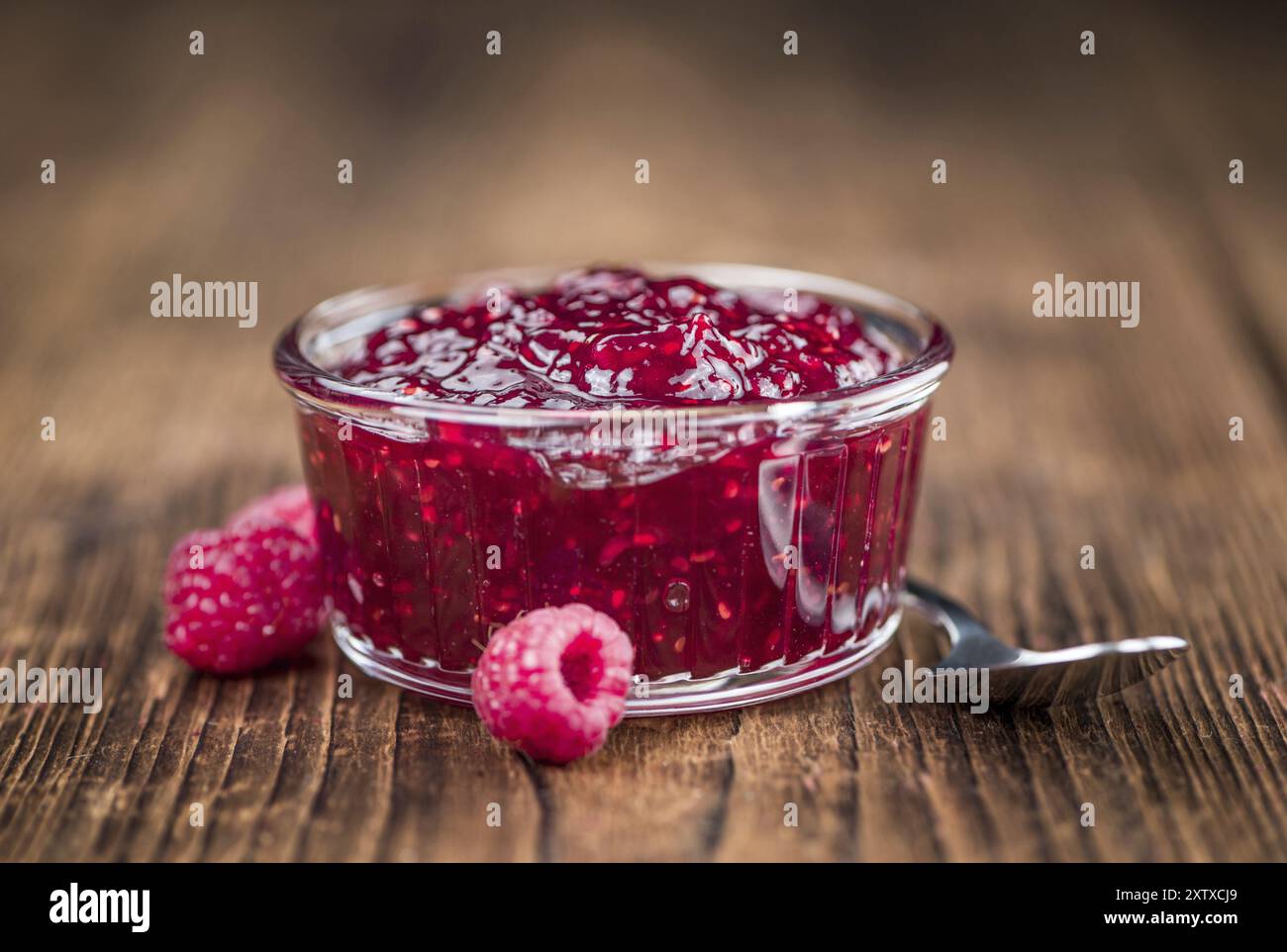 Fresh made Raspberry Jam on a vintage background as detailed close-up ...