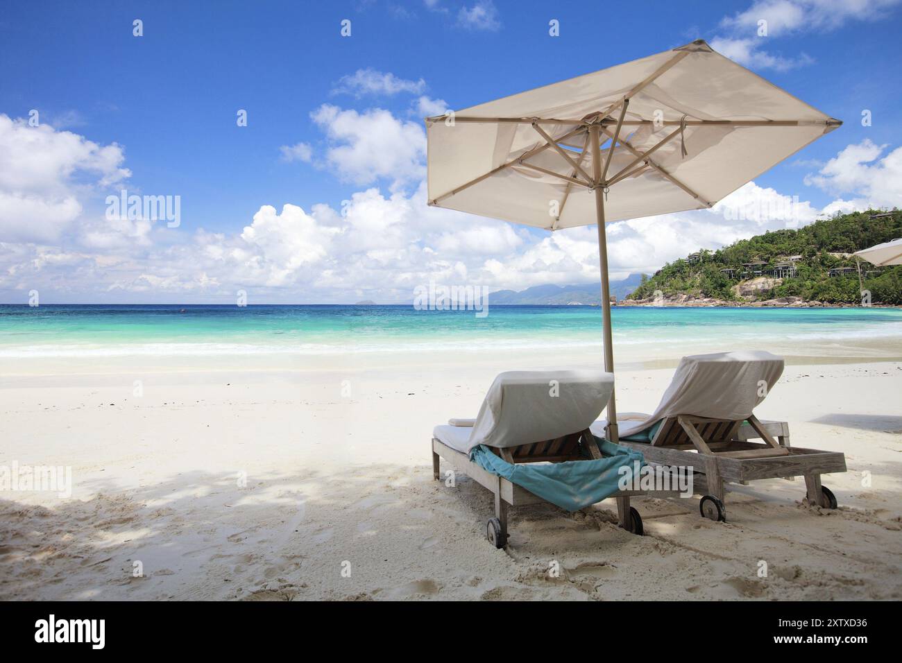 Two deckchairs and a parasol on the beach of La Digue, Seychelles, La ...
