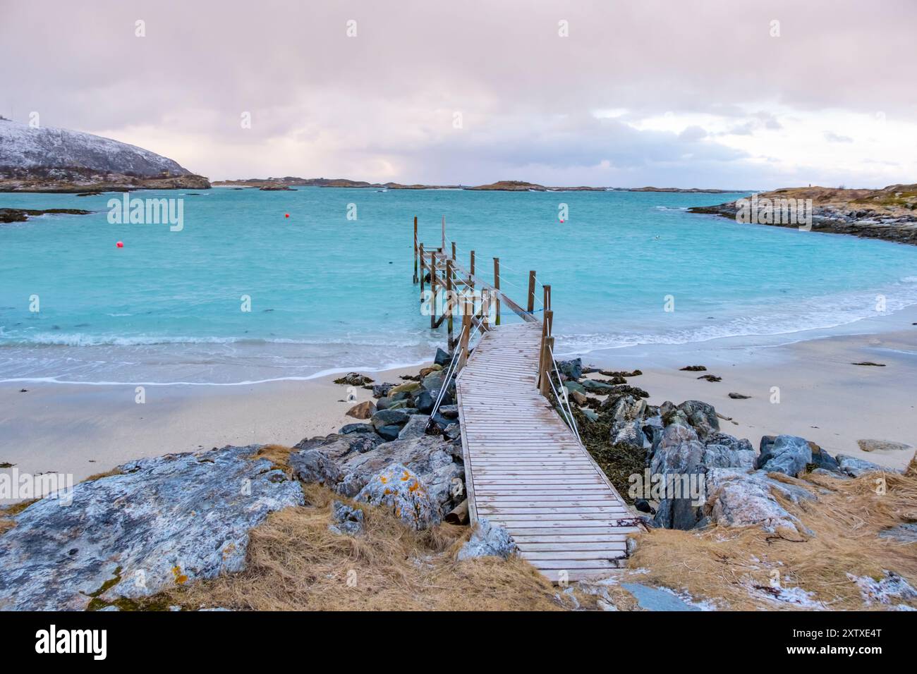 Sommaroy islands and arctic sea near Tromso Norway. Sunset over snowy ...