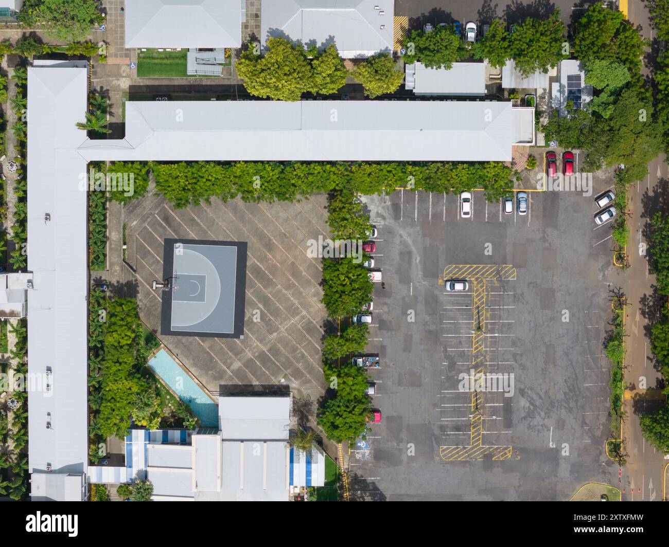Basketball field next to parking lot above top drone view Stock Photo ...