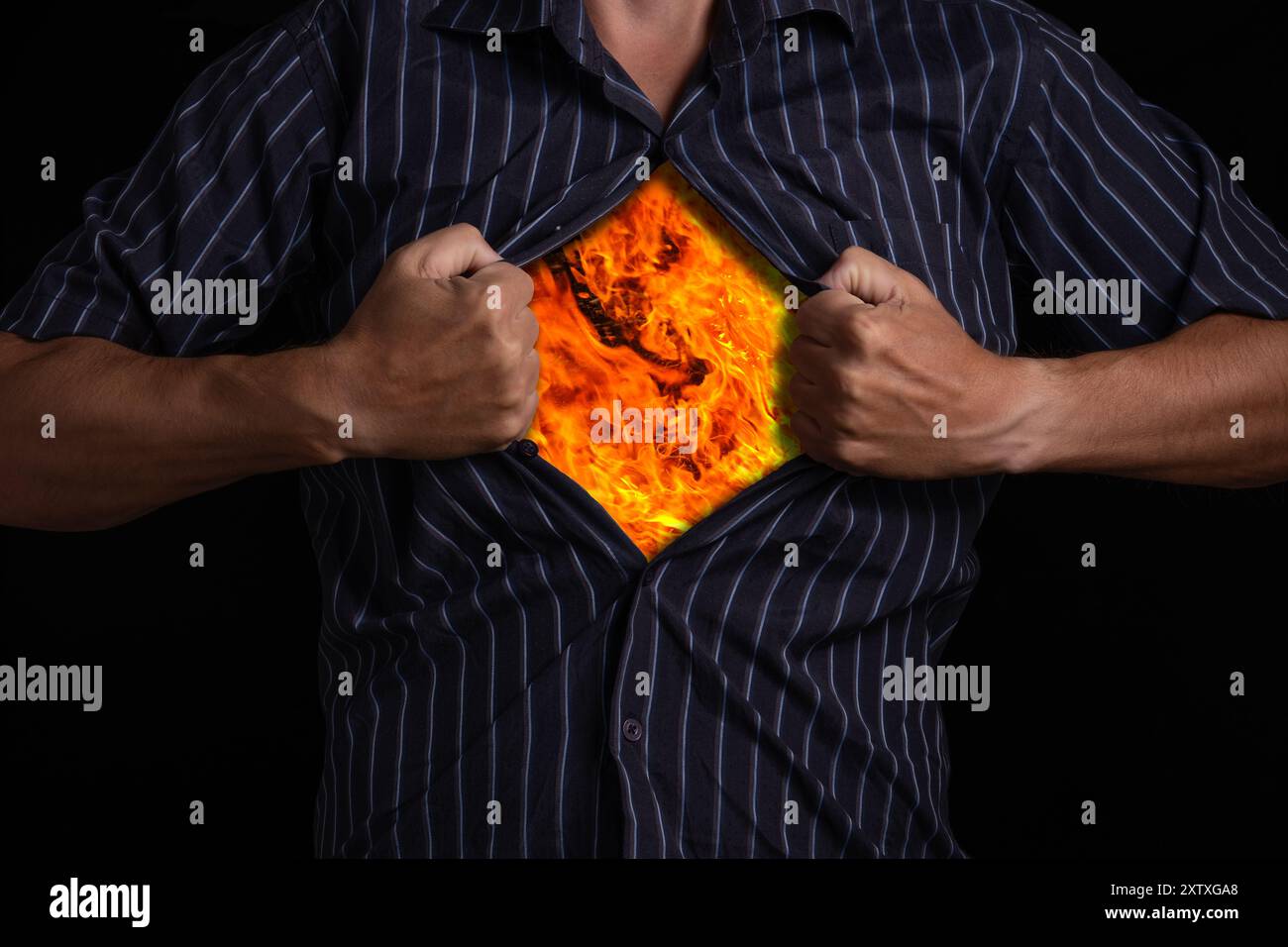 Man tears open his shirt, exposing raging flame inside, symbolizing ...
