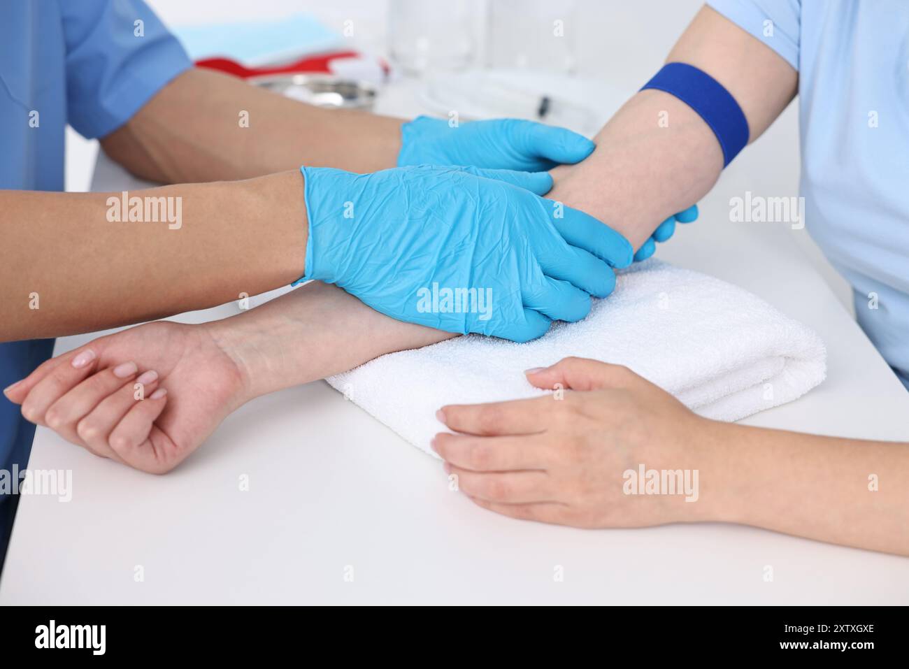 Nurse inputting catheter for IV drip in patient hand, closeup Stock ...