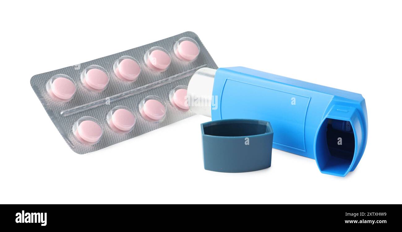 Asthma treatment. Inhaler and pills isolated on white Stock Photo - Alamy