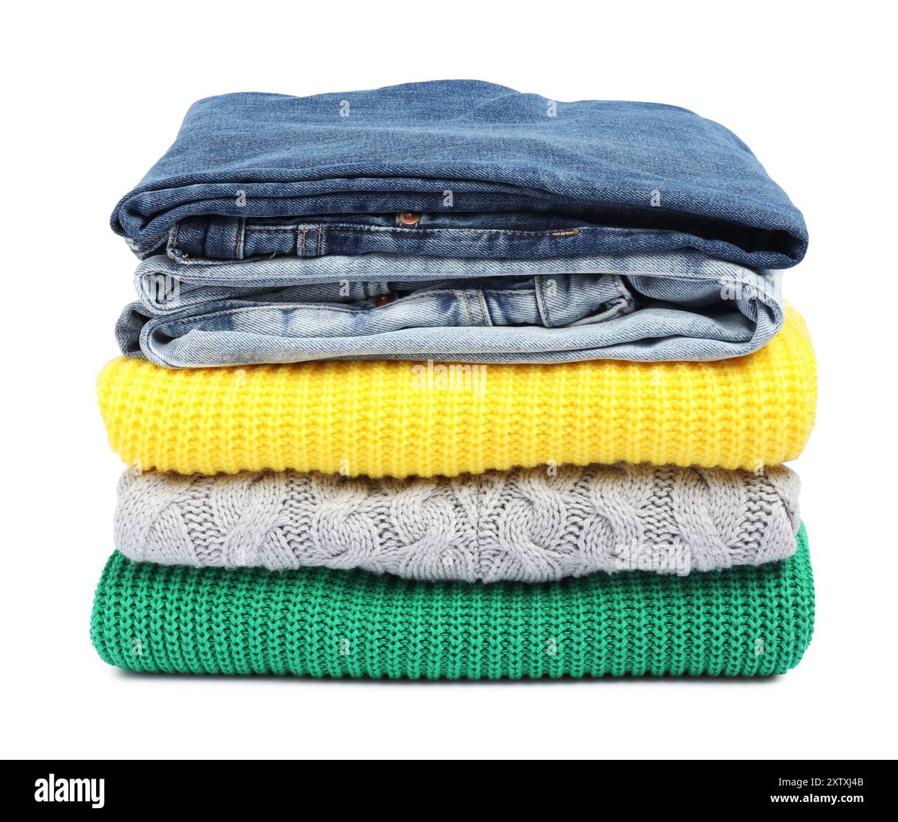 Stack of sweaters and jeans isolated on white Stock Photo - Alamy