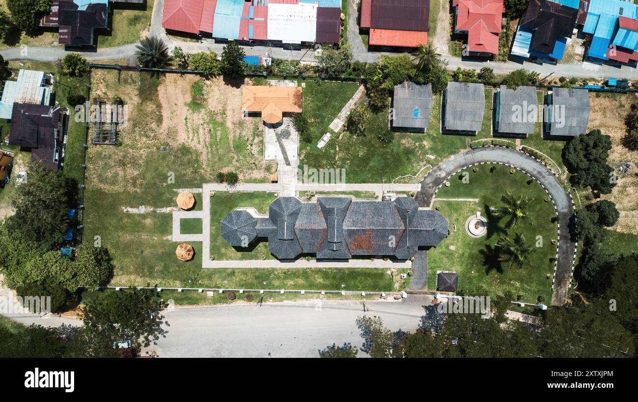 Aerial view of a residential area with houses, a large building, and ...