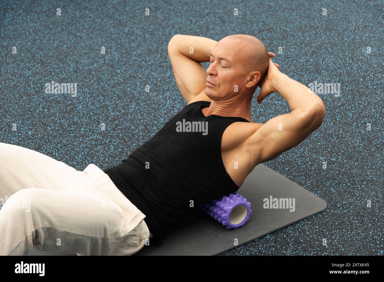 Back massage trigger point using foam roller. Myofascial Release Stock ...