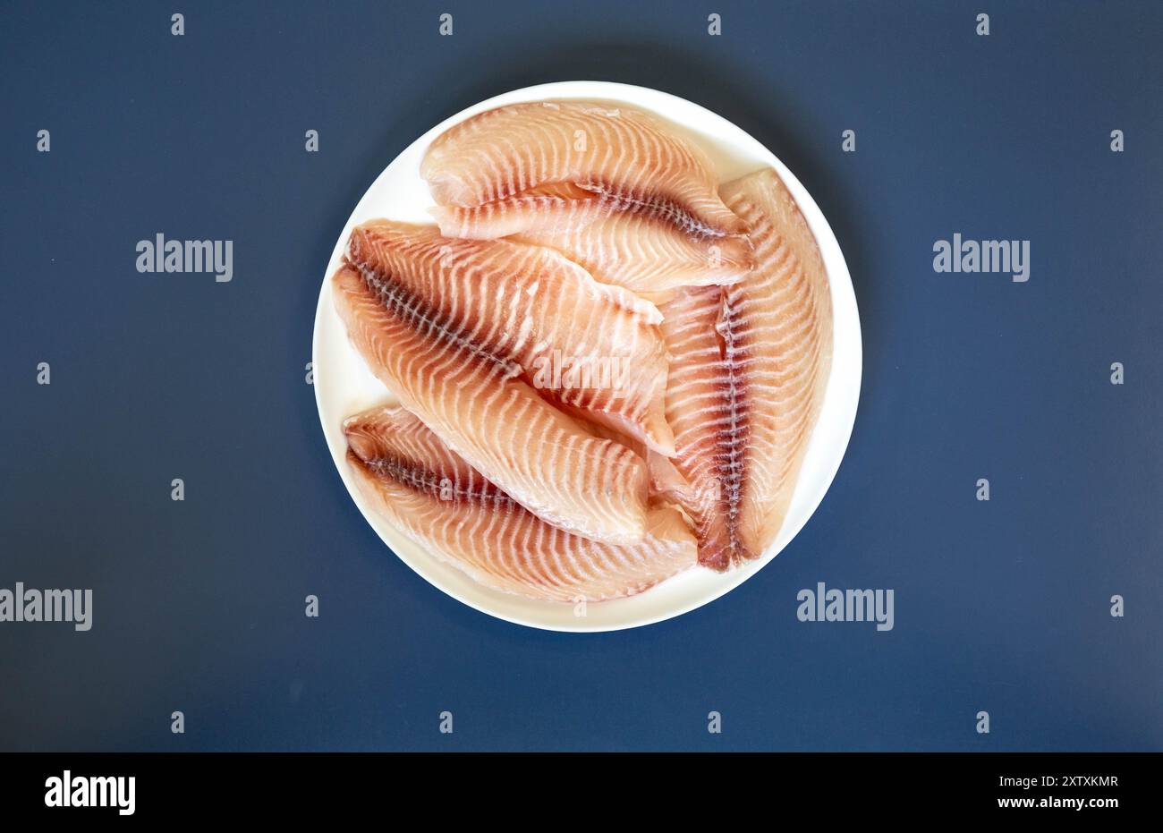 Fillet of tilapia or Saint Peter fish Oreochromis niloticus. Isolated ...