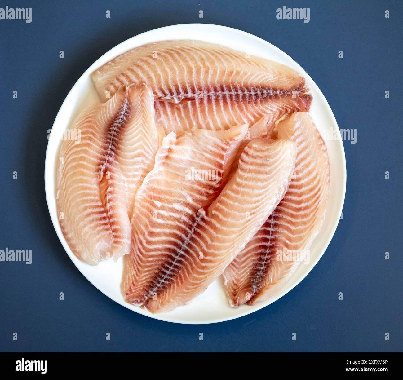 Fillet of tilapia or Saint Peter fish Oreochromis niloticus. Isolated ...