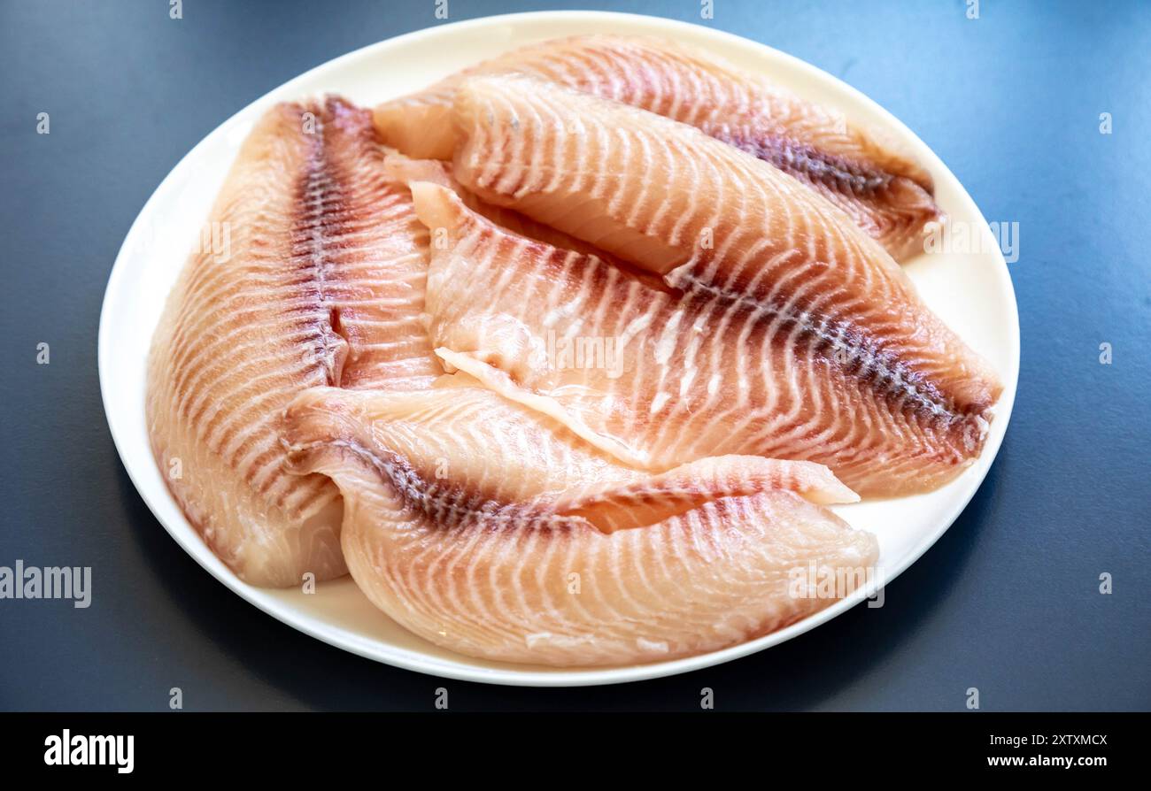 Fillet of tilapia or Saint Peter fish Oreochromis niloticus. Isolated ...