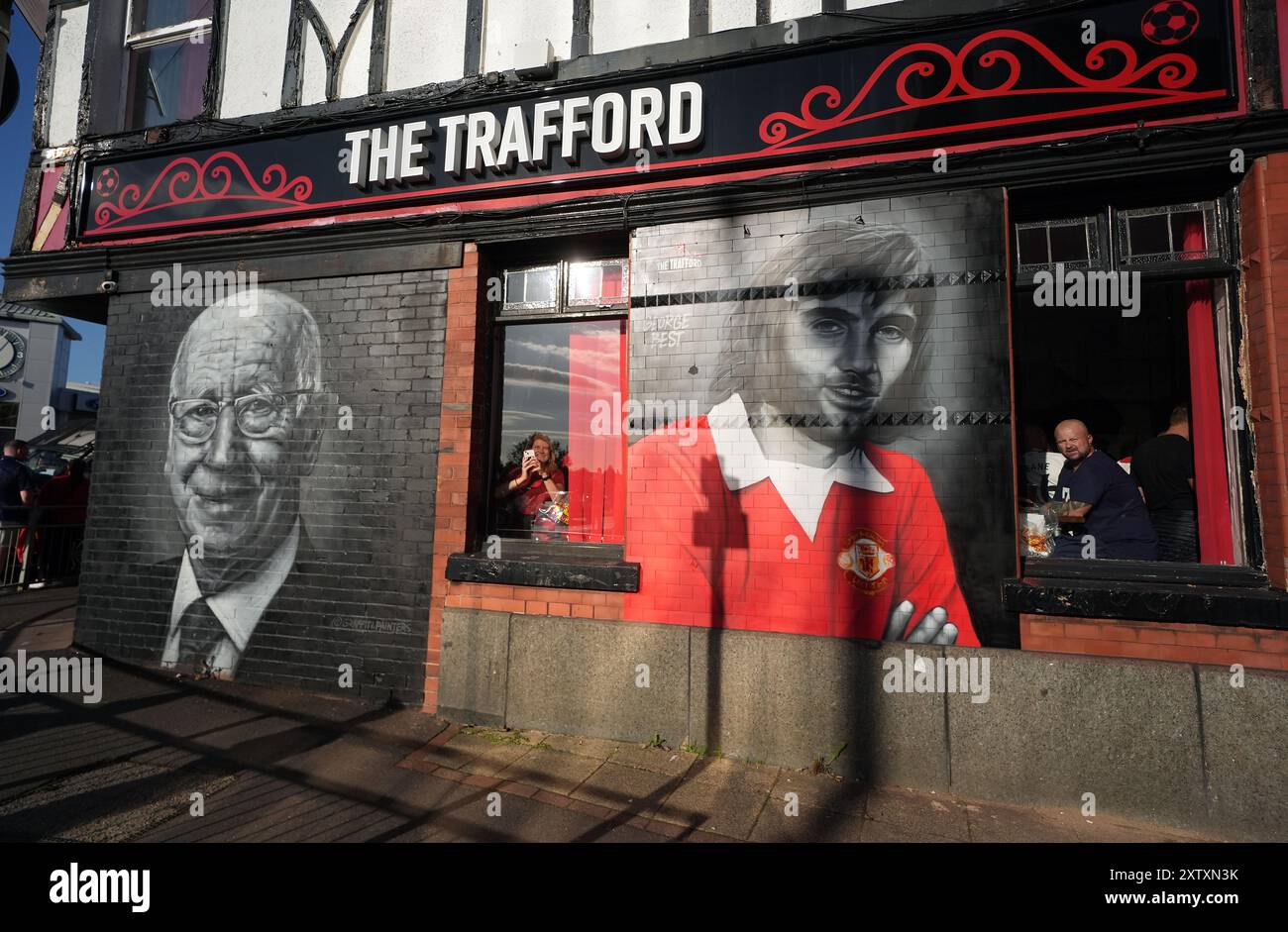 A mural of former players Bobby Charlton and George Best near the ...