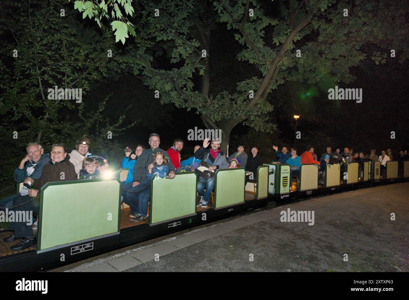 Night ride on the park railway for the long night Stock Photo - Alamy