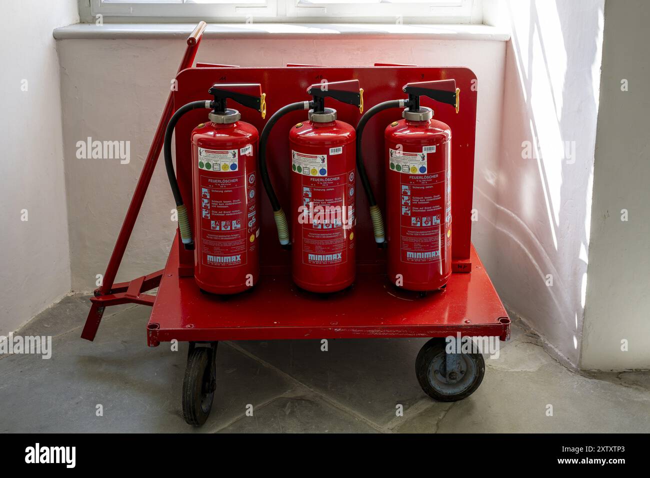 Handcart, equipped with fire extinguisher in the cloister, Salem Castle ...