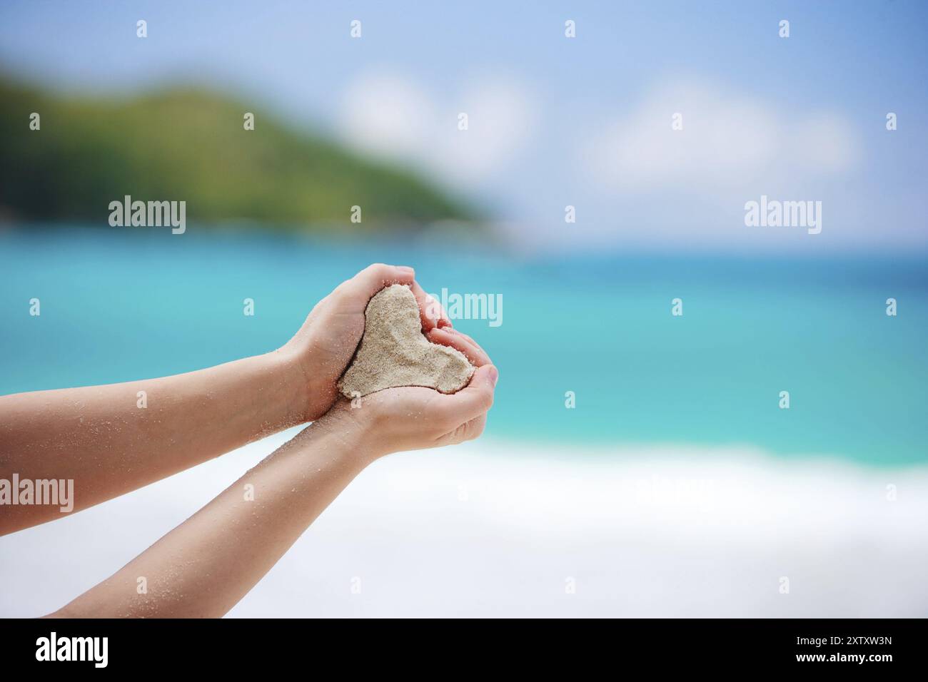A heart of sand, Hands of a woman, Valentine's Day, Seychelles, La ...