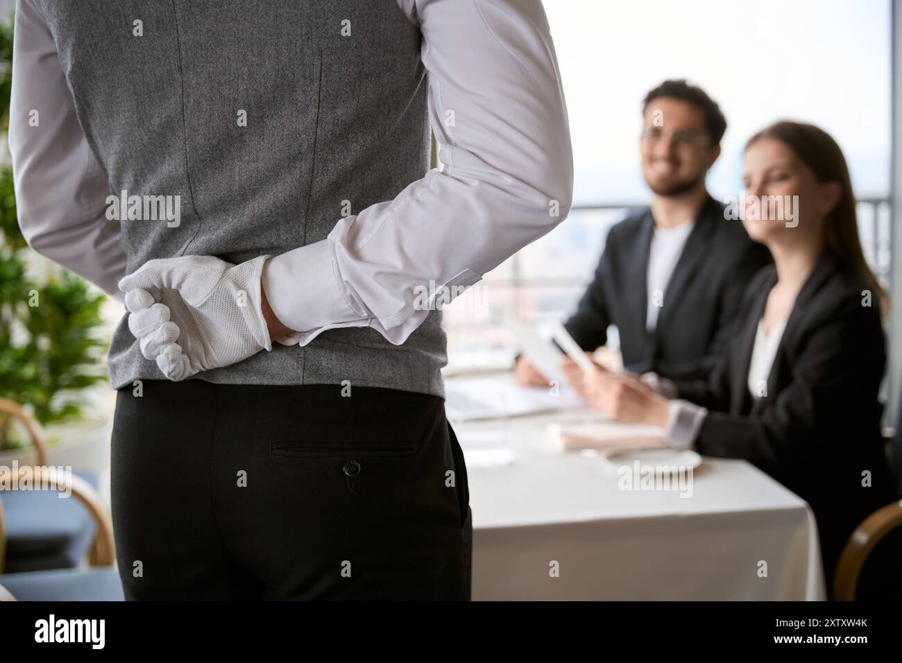 Couple hand behind back table hi-res stock photography and images - Alamy