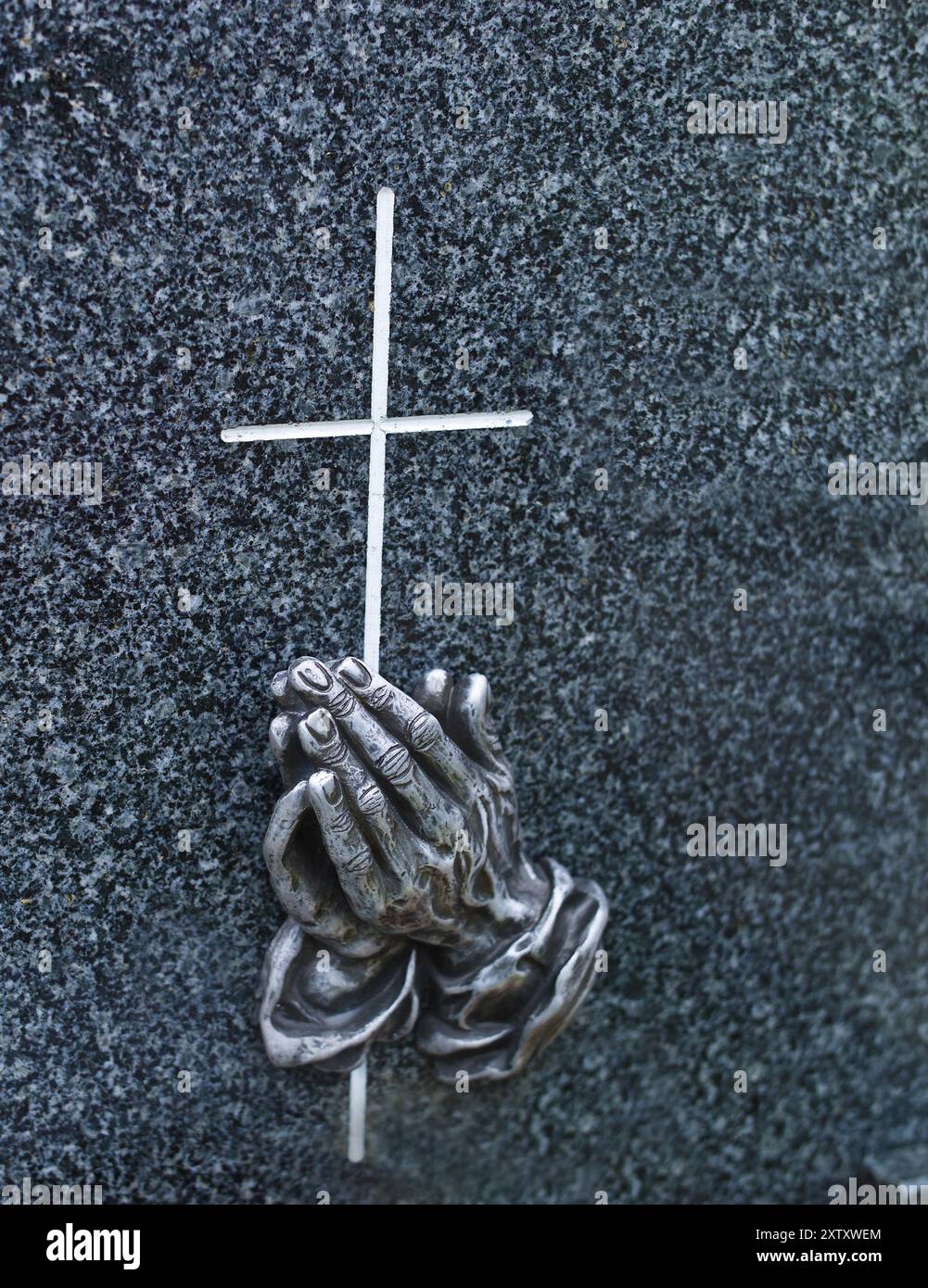Praying hands a tombstone hi-res stock photography and images - Alamy