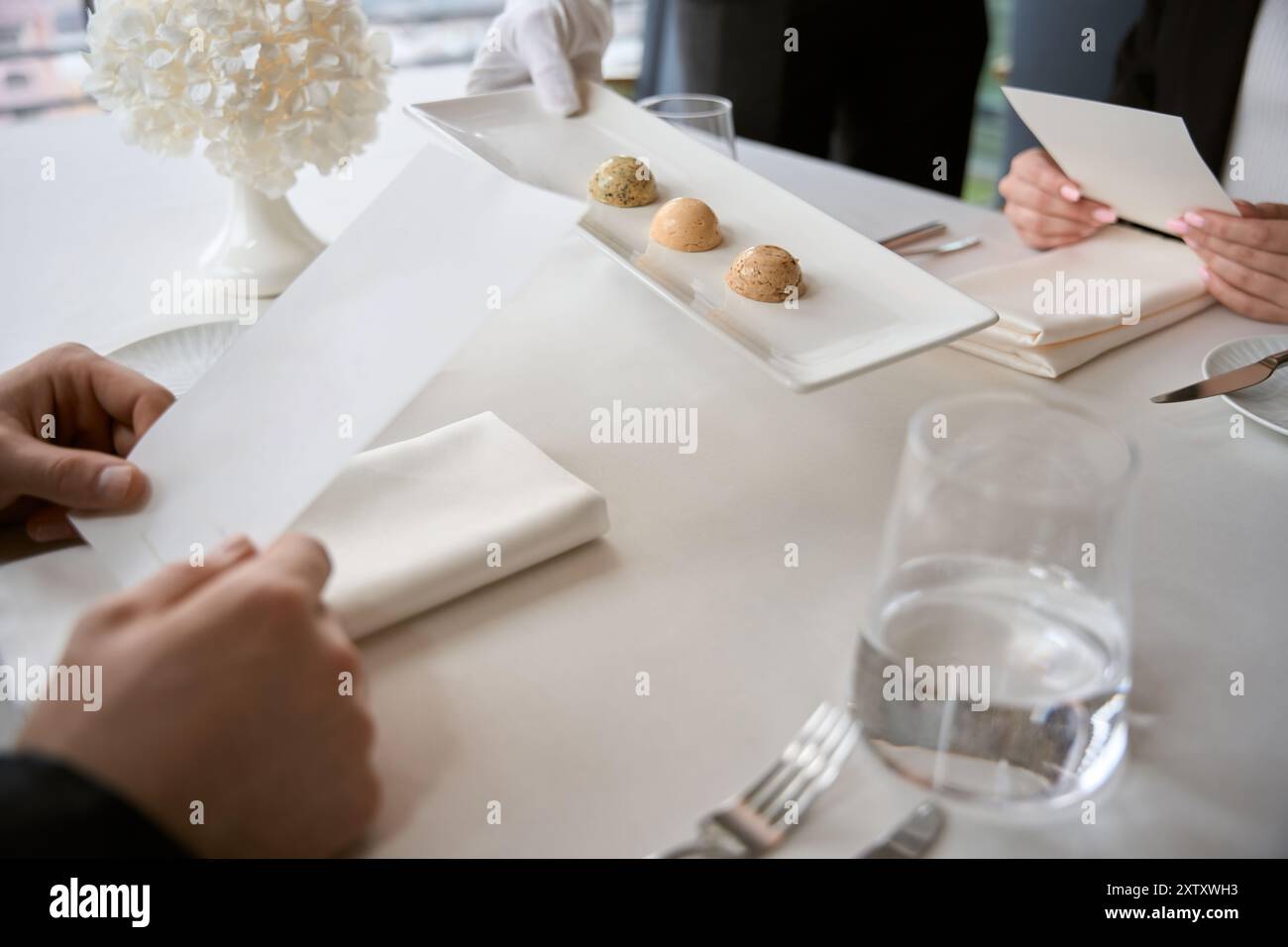 Male waiter putting menu hi-res stock photography and images - Alamy