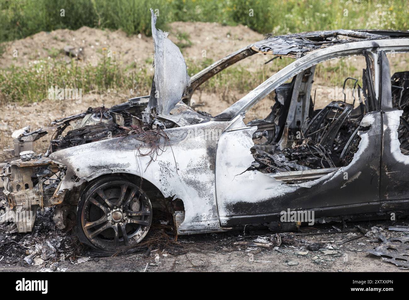 Road wreck accident or arson fire burnt wheel car vehicle junk Stock ...
